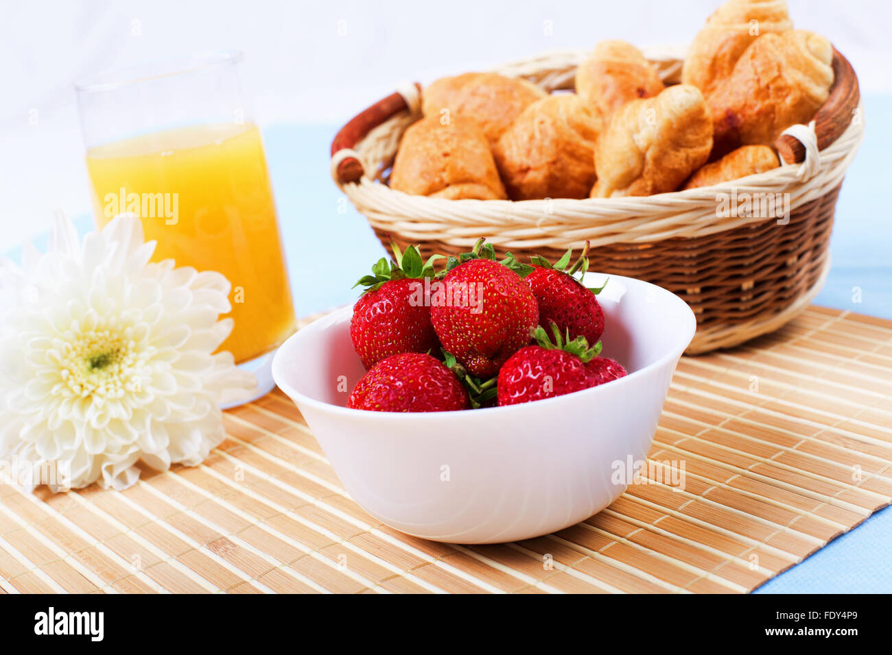 Early breakfast. Strawberries, cream and juice. The symbol of healthy ...