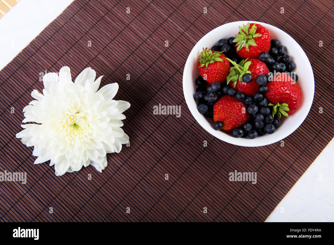 Early breakfast. Strawberries, cream and juice. The symbol of healthy ...