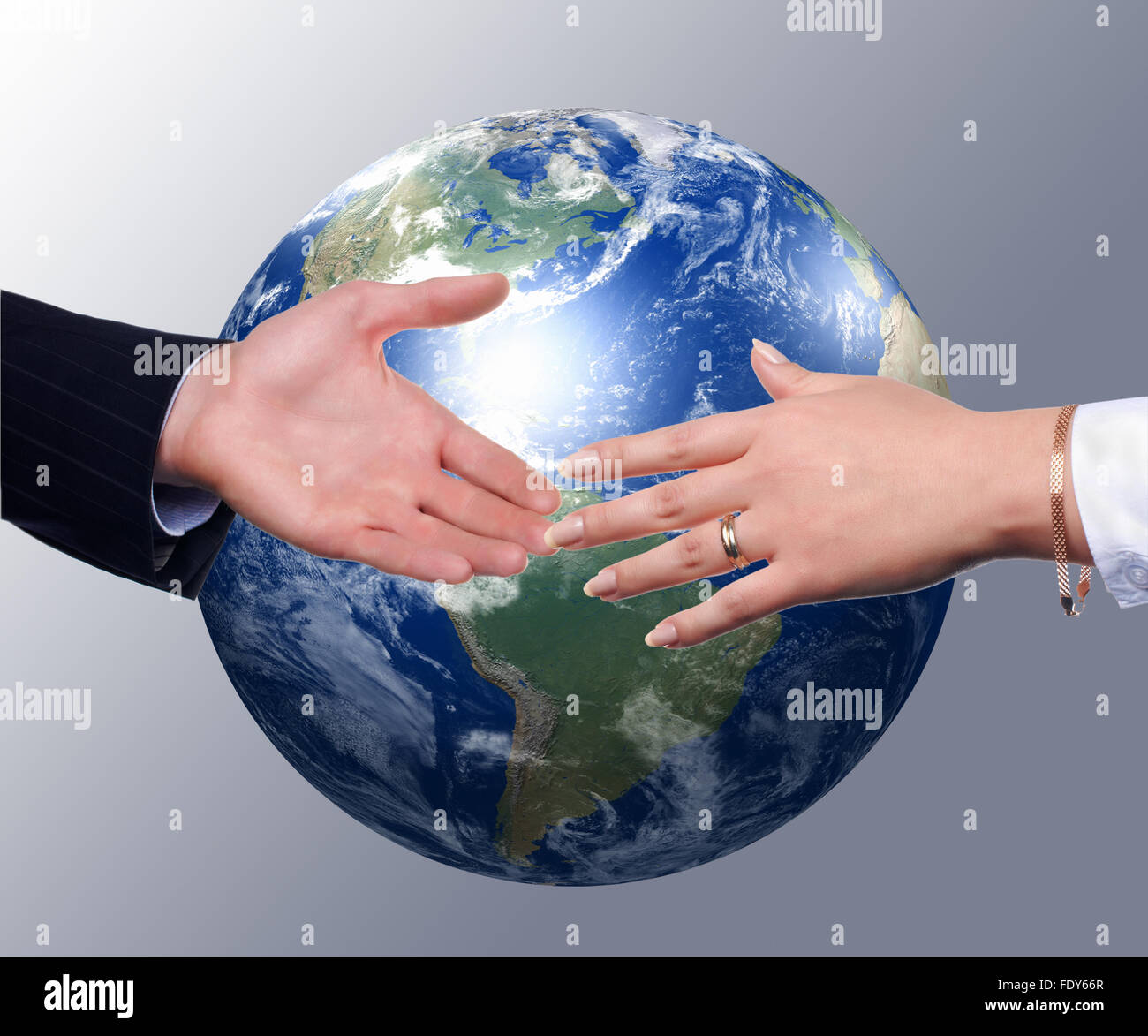 Business handshake on the background of the Earth. The symbol of a ...