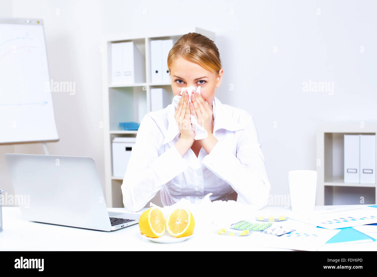 Young woman feeling unwell and sick in office Stock Photo - Alamy