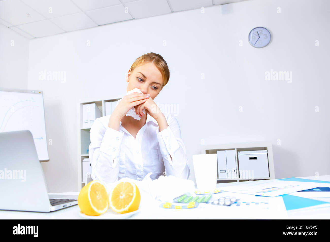 Young woman feeling unwell and sick in office Stock Photo - Alamy
