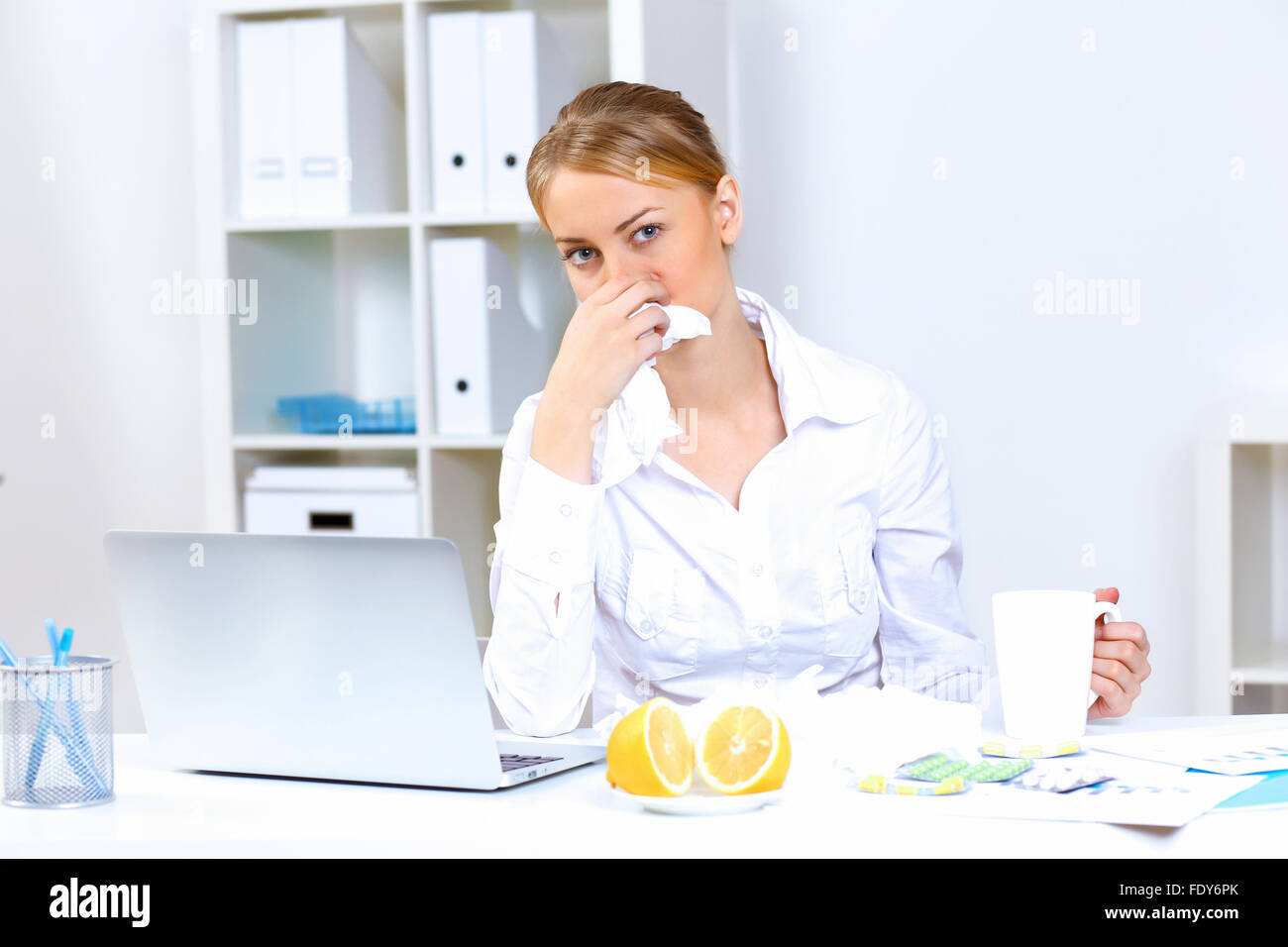 Young woman feeling unwell and sick in office Stock Photo - Alamy
