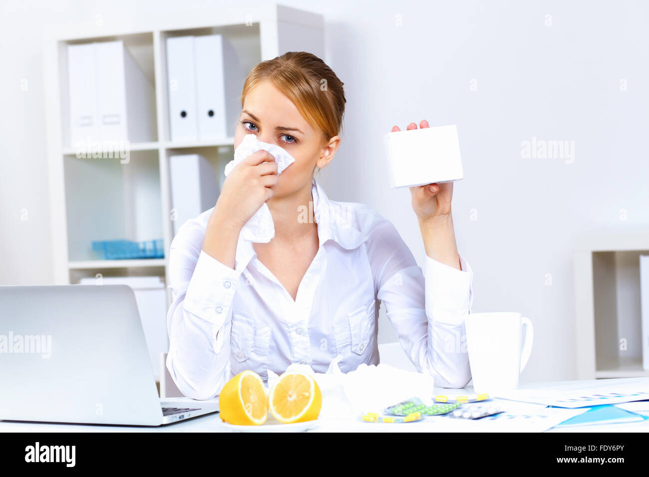 Young woman feeling unwell and sick in office Stock Photo - Alamy