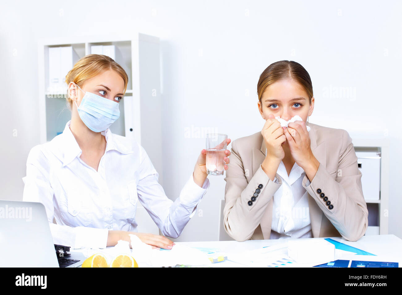 Young woman feeling unwell and sick in office Stock Photo - Alamy
