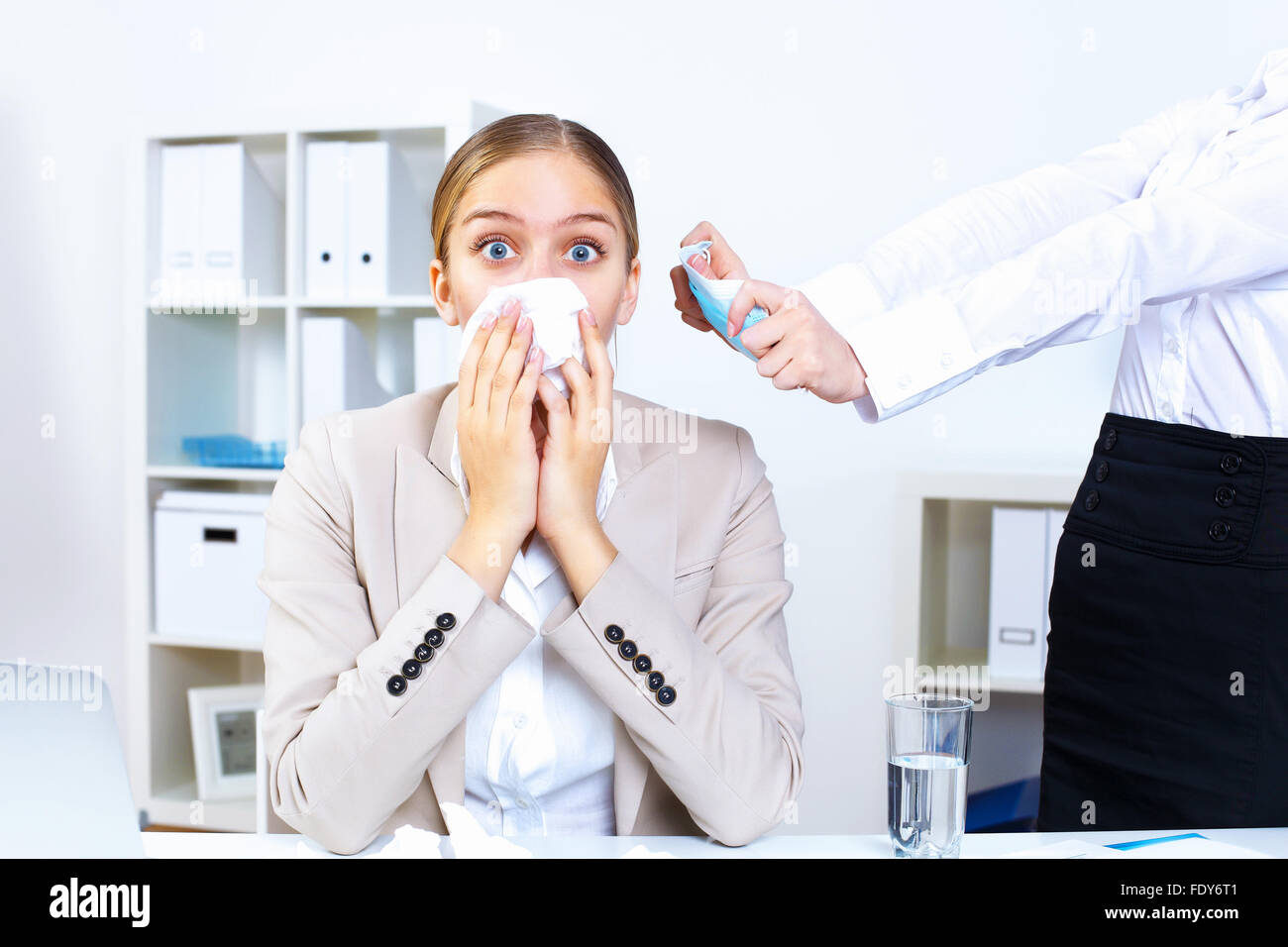 Young woman feeling unwell and sick in office Stock Photo - Alamy