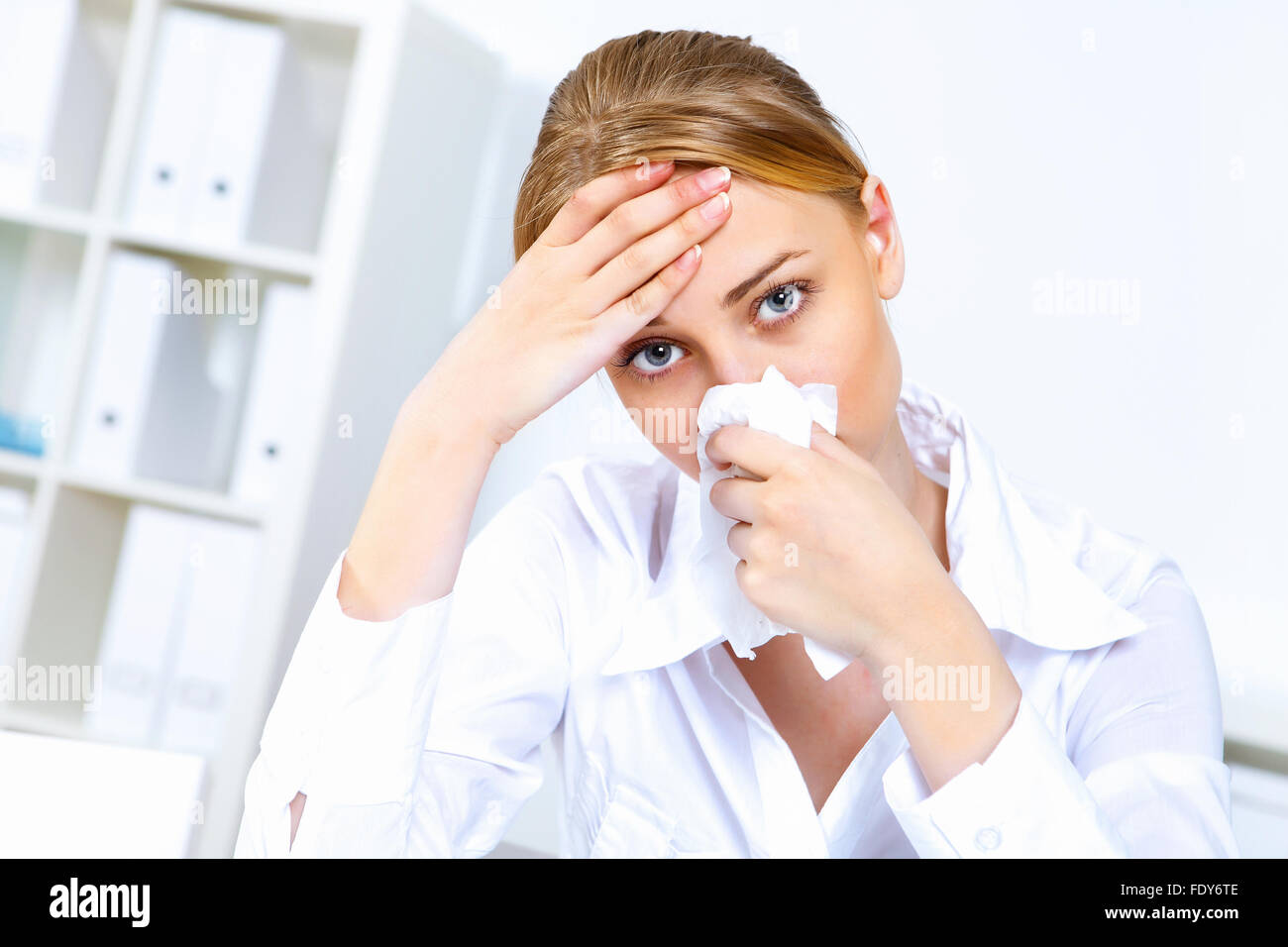 Young woman feeling unwell and sick in office Stock Photo - Alamy