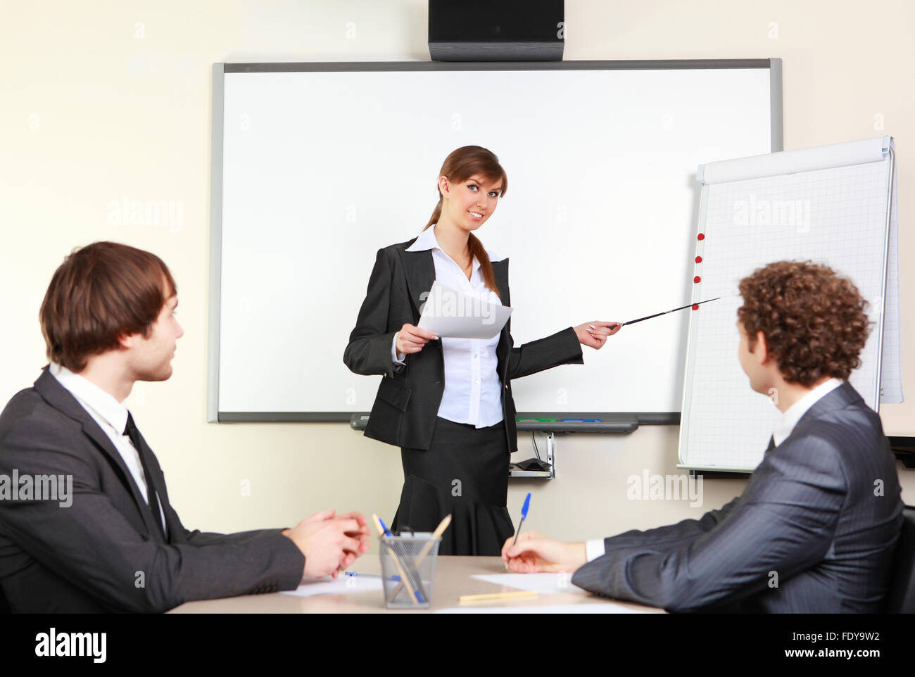 a young business woman making presentation in an office Stock Photo - Alamy