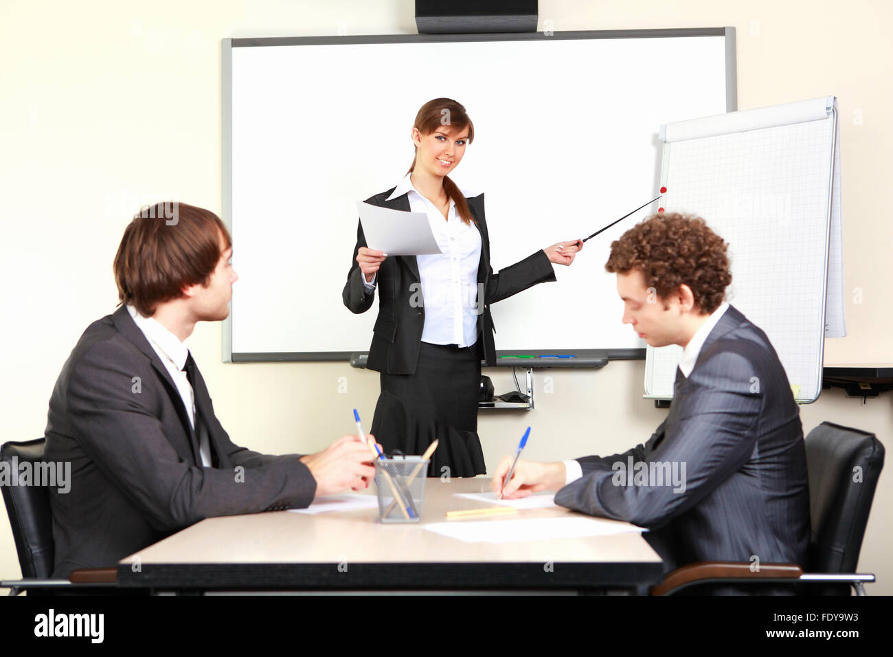 a young business woman making presentation in an office Stock Photo - Alamy