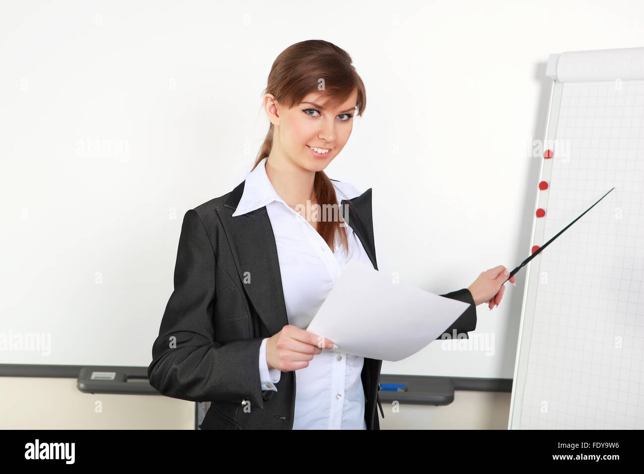 a young business woman making presentation in an office Stock Photo - Alamy
