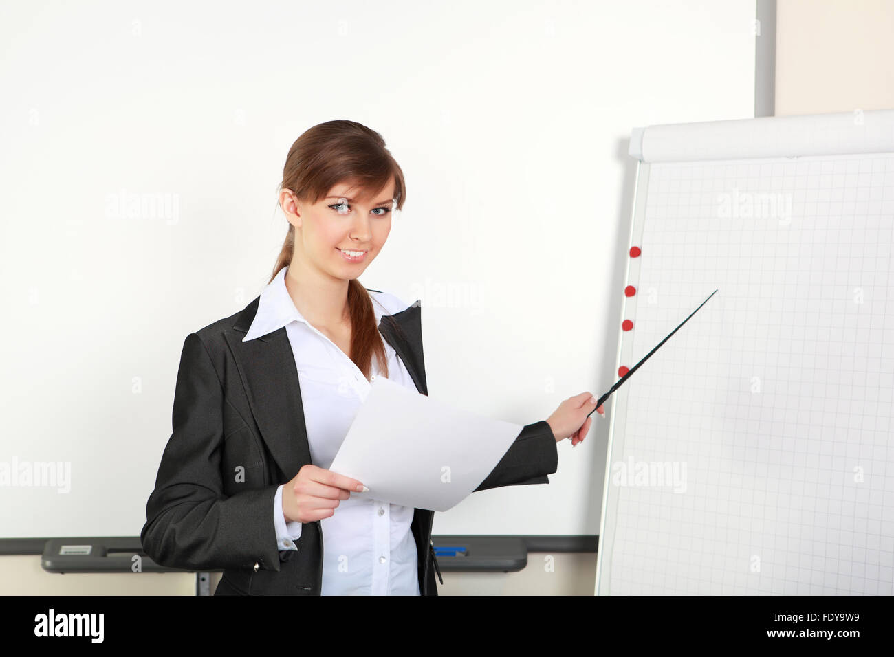 a young business woman making presentation in an office Stock Photo - Alamy