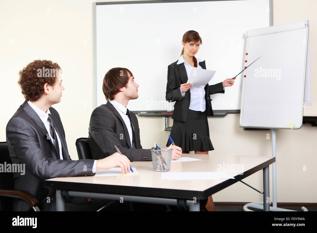 a young business woman making presentation in an office Stock Photo - Alamy