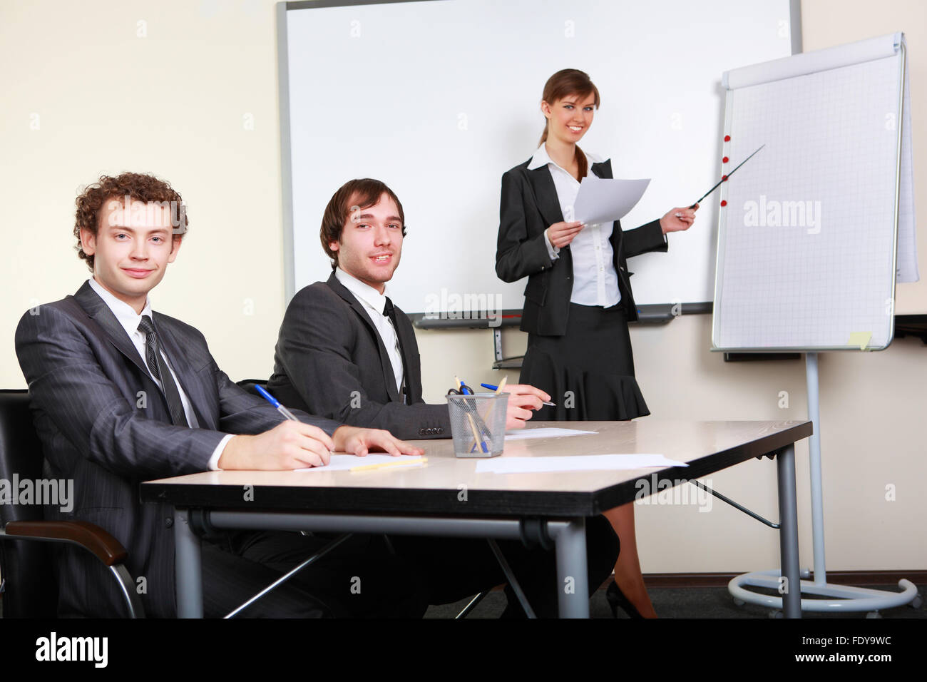a young business woman making presentation in an office Stock Photo - Alamy