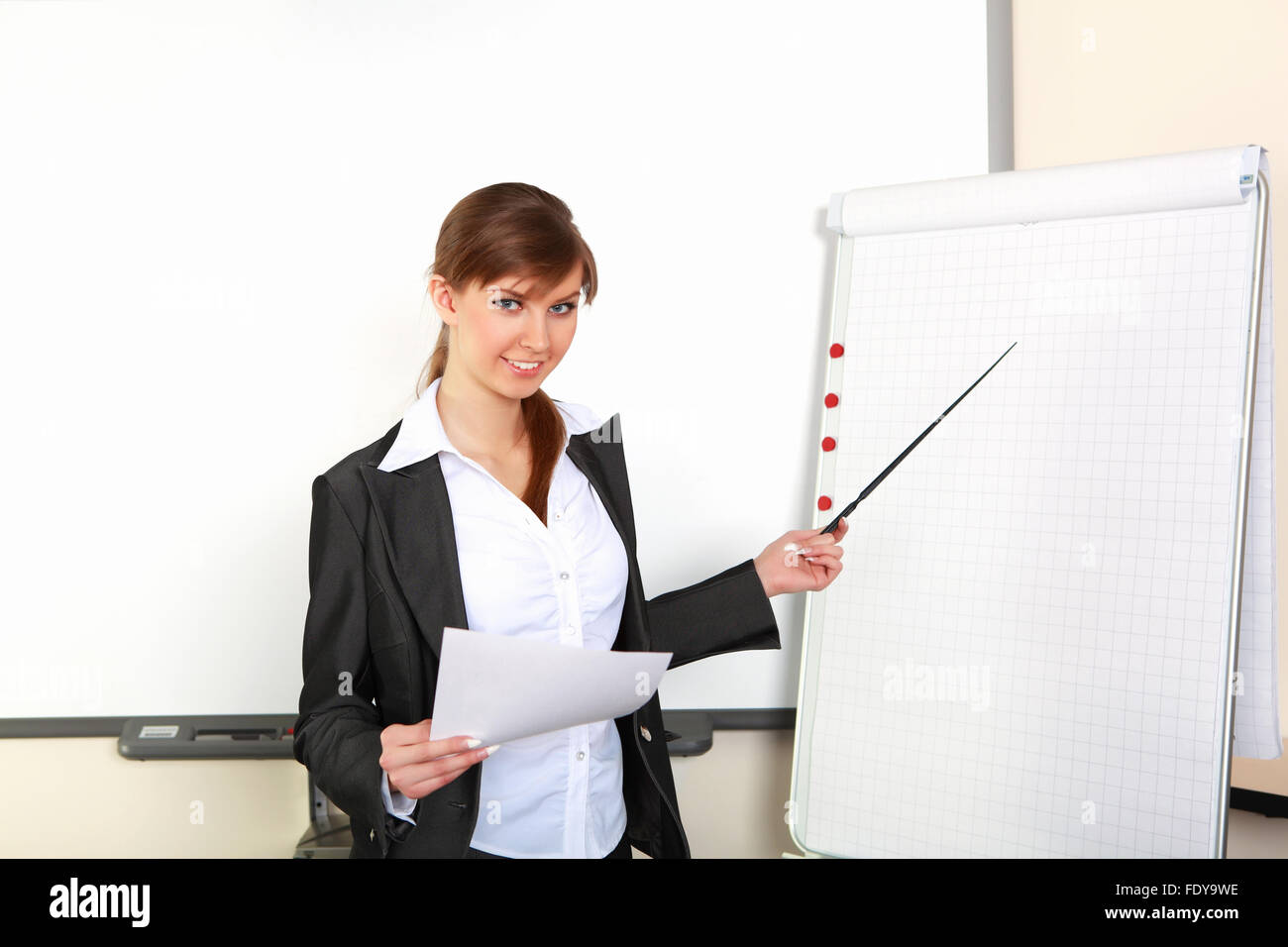 a young business woman making presentation in an office Stock Photo - Alamy