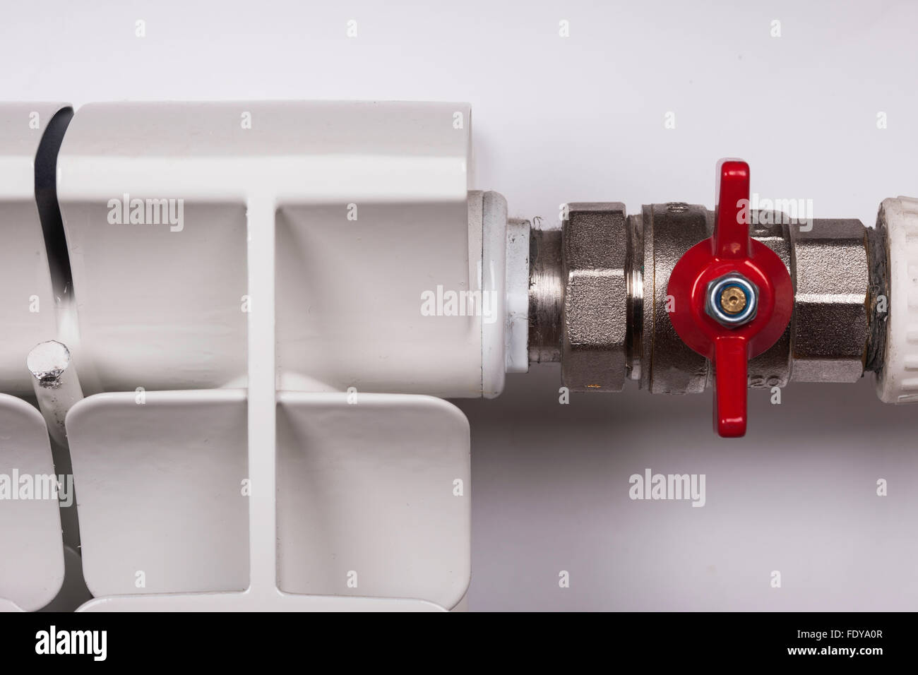 White radiator convector in an apartment faucet valve Stock Photo - Alamy