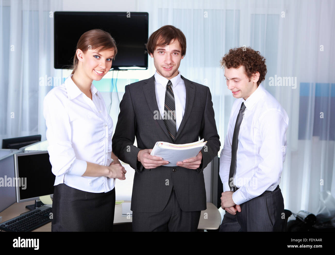 a group of young and successful businessmen in iffice together Stock ...