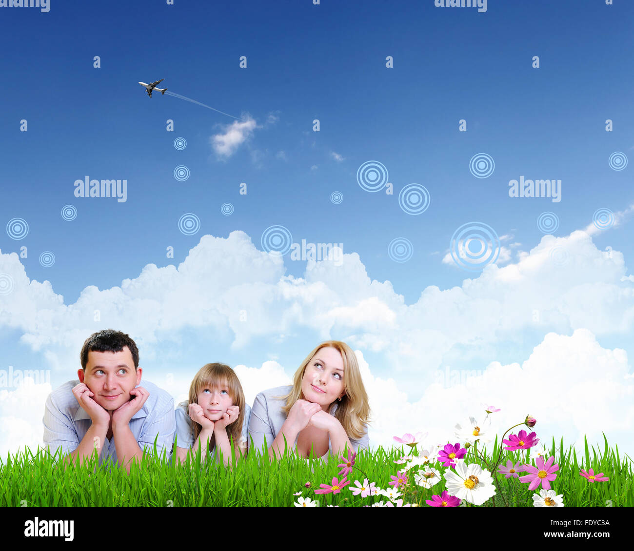 Collage with children and parents on green grass and under blue sky ...