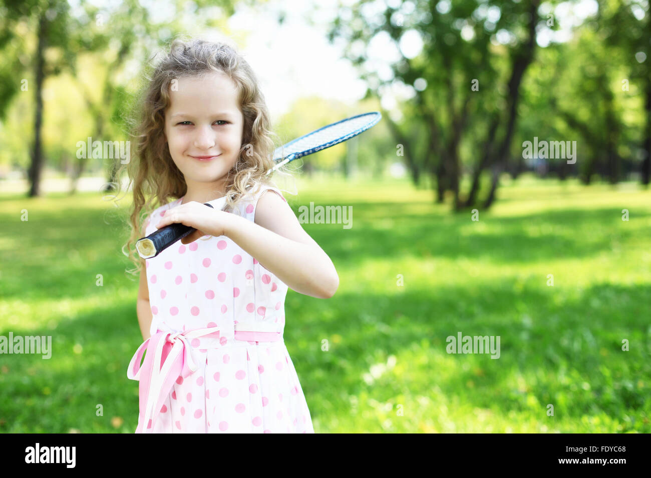 Little happy girl having fun in green summer park Stock Photo - Alamy