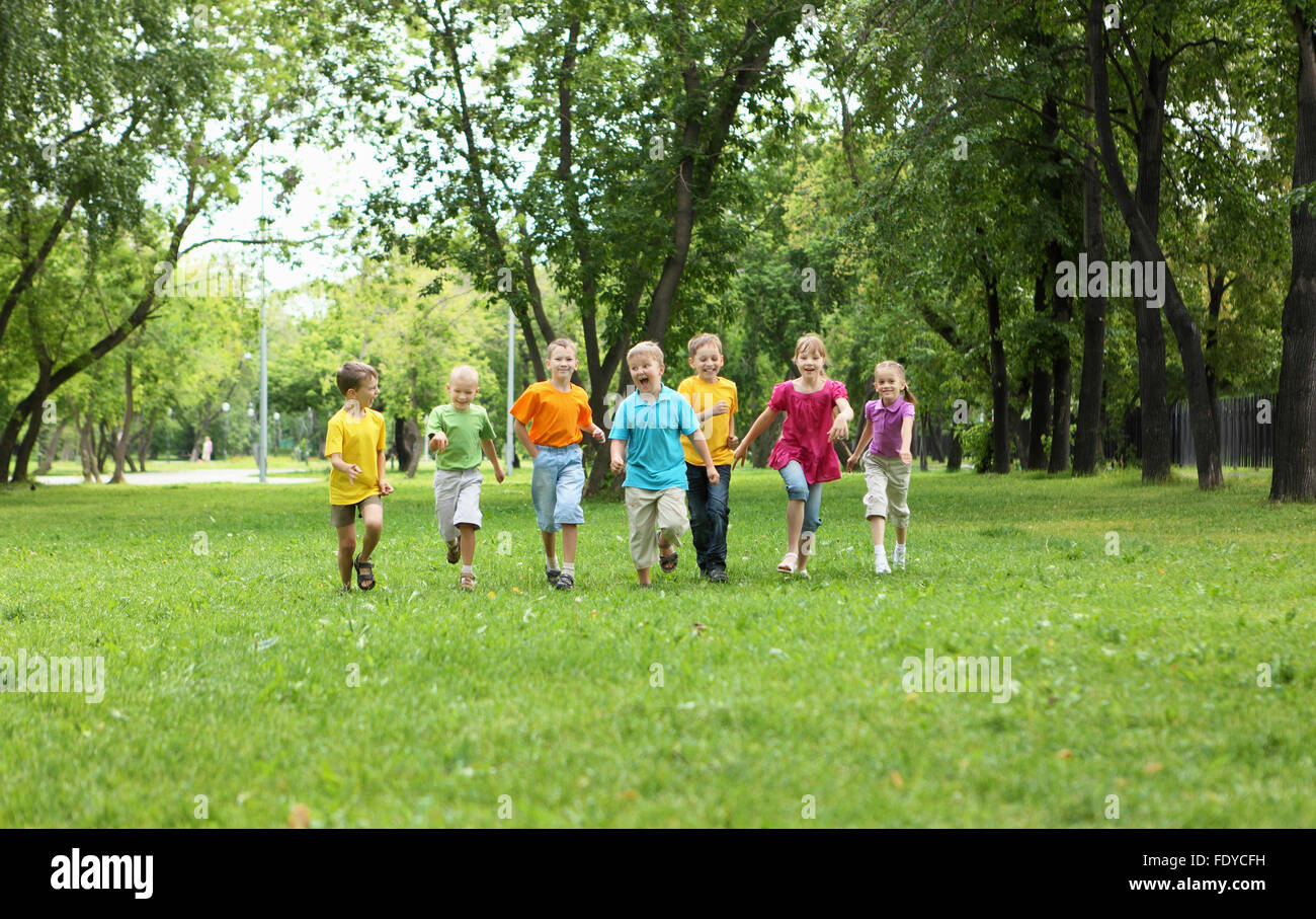 Group of children having fun together in the park Stock Photo - Alamy
