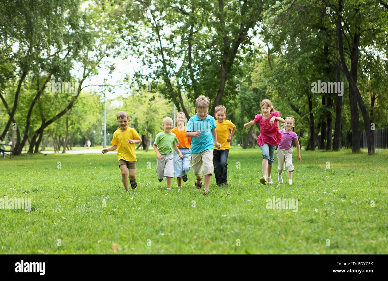 Group of children having fun together in the park Stock Photo - Alamy