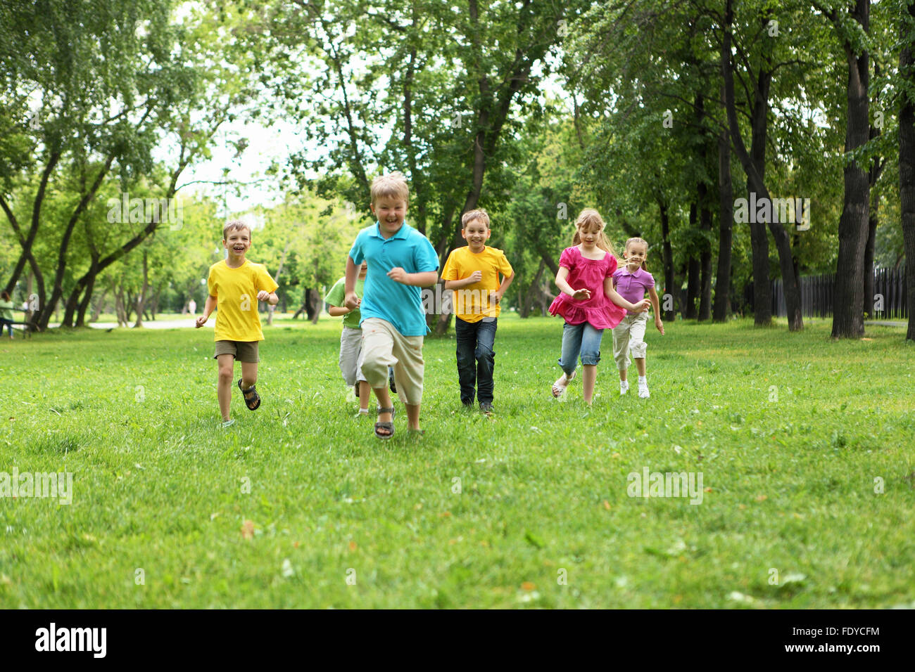 Group of children having fun together in the park Stock Photo - Alamy