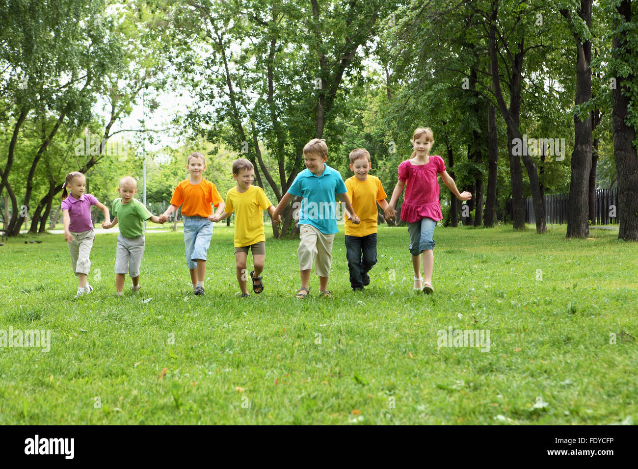 Group of children having fun together in the park Stock Photo - Alamy