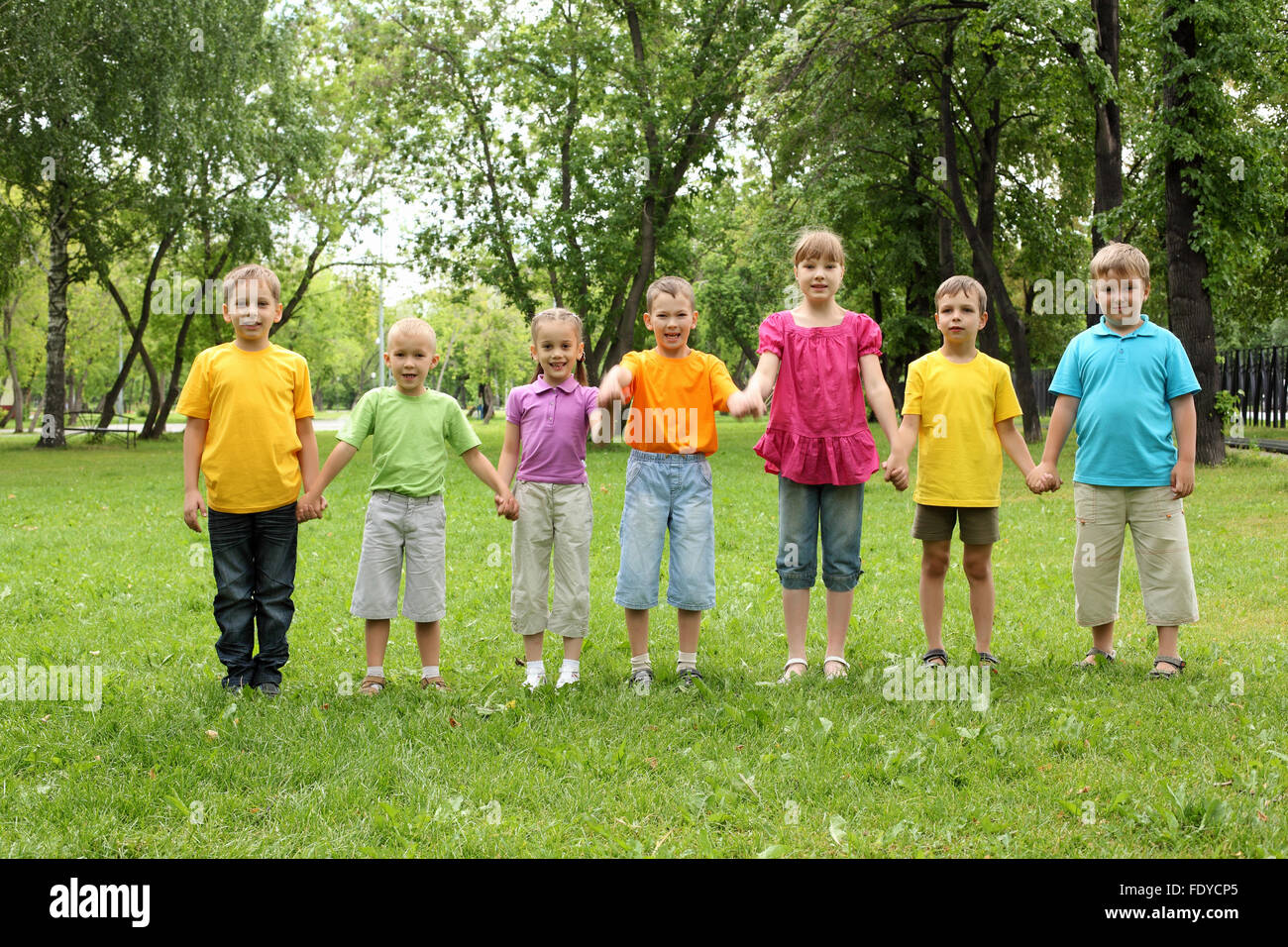 Group of children having fun together in the park Stock Photo - Alamy