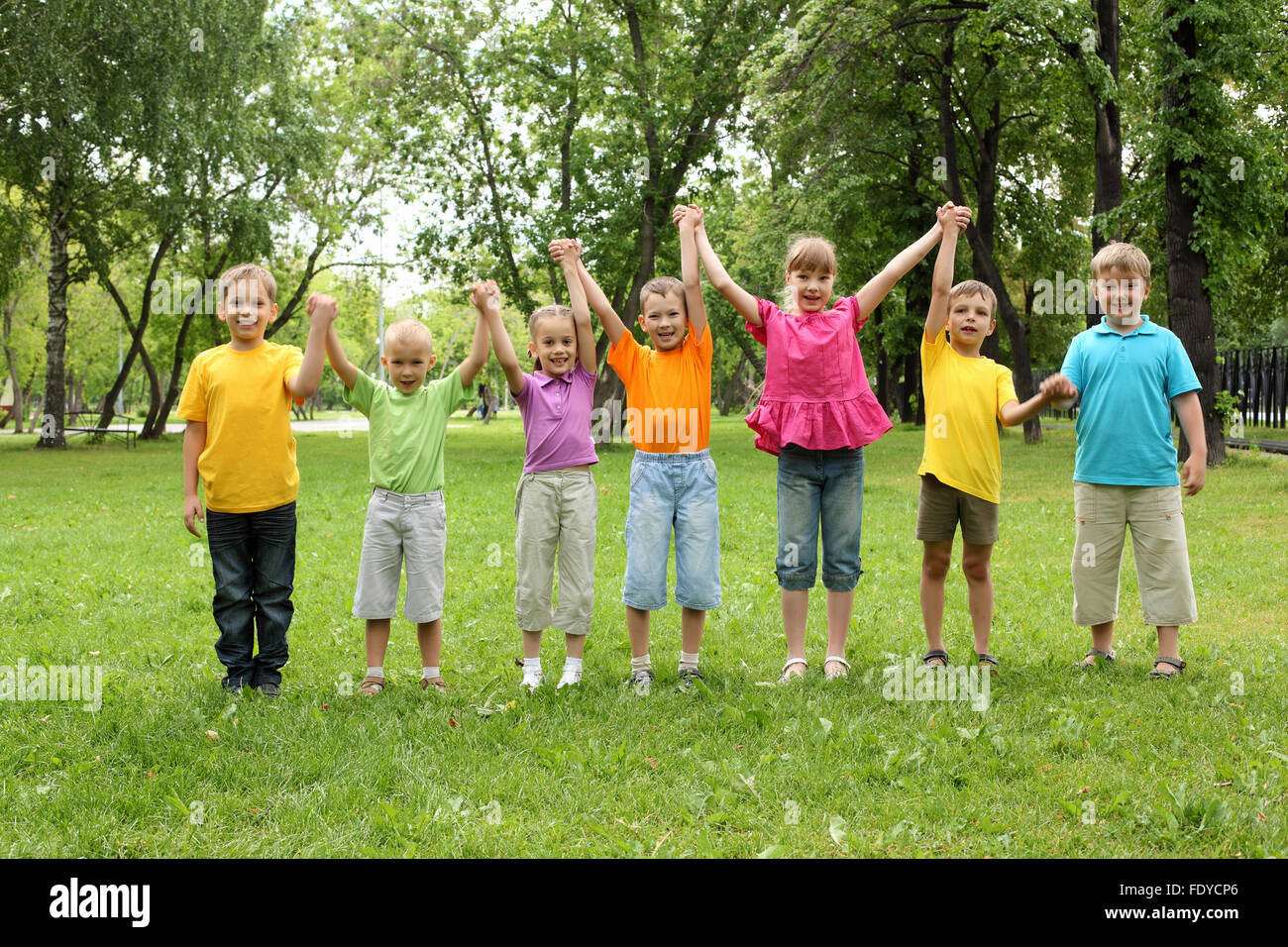 Group of children having fun together in the park Stock Photo - Alamy