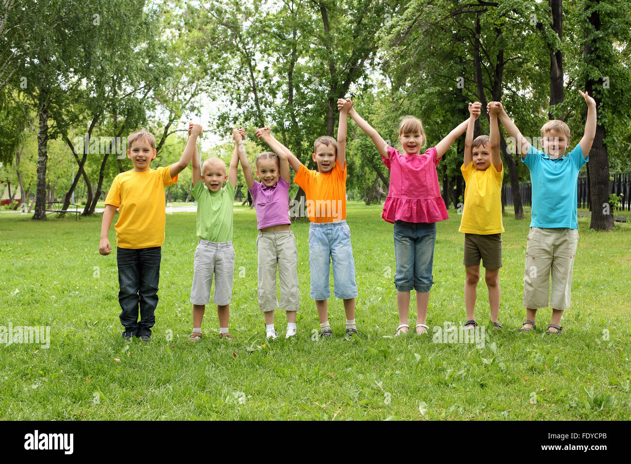 Diverse group of happy children are smiling and laughing together hi ...