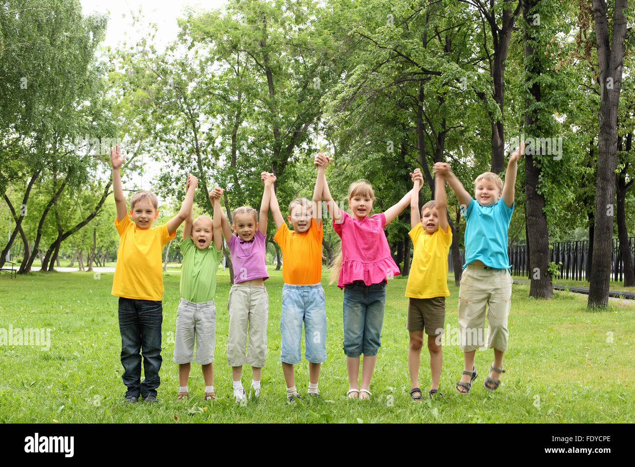Group of children having fun together in the park Stock Photo - Alamy