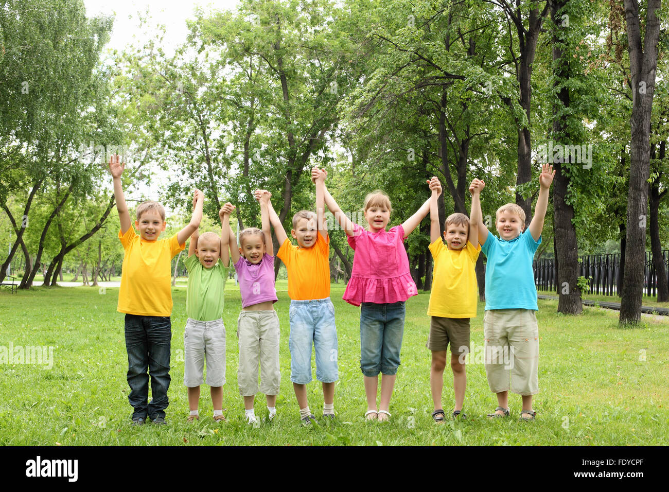 Diverse group of happy children are smiling and laughing together hi ...