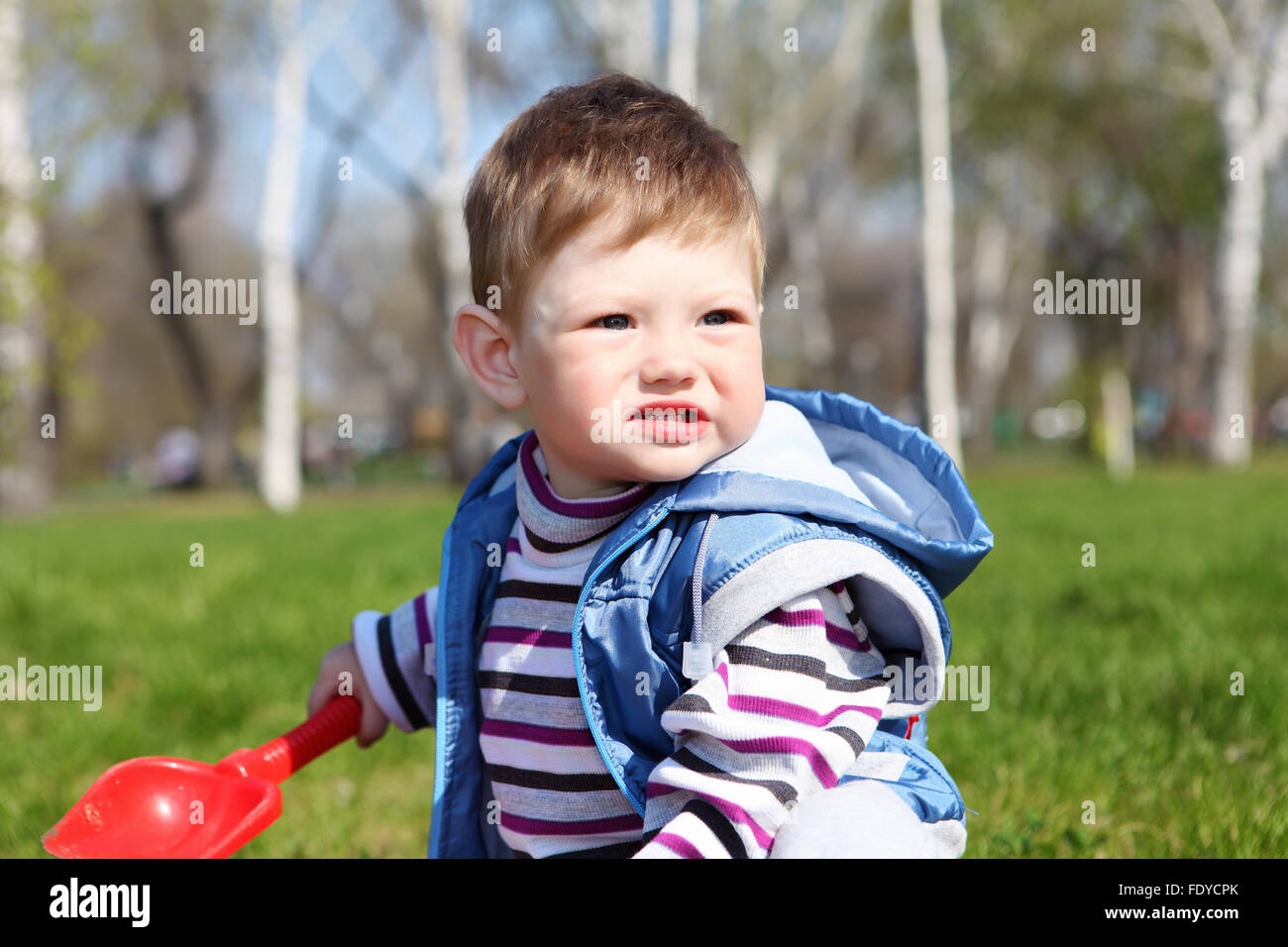 portrait of little boy in spring park Stock Photo - Alamy