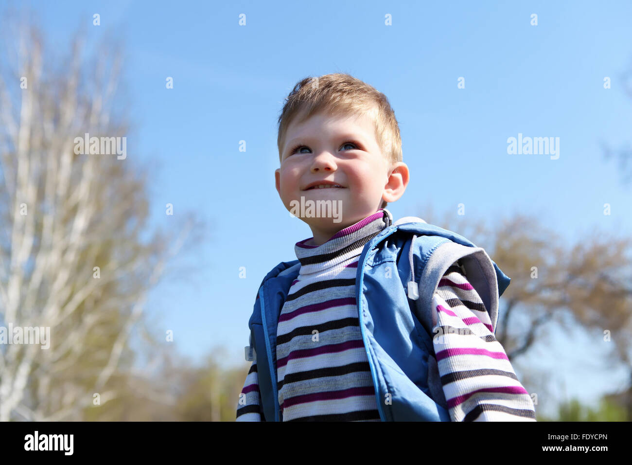portrait of little boy in spring park Stock Photo - Alamy