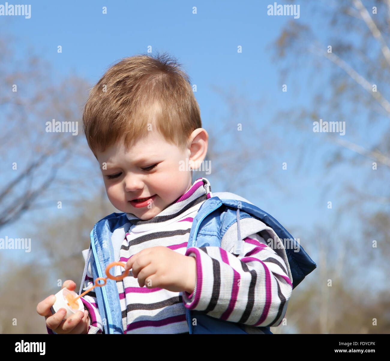 portrait of little boy in spring park Stock Photo - Alamy