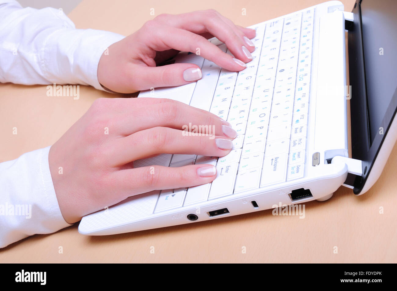 Hands of a young girl running on a computer in the office Stock Photo ...