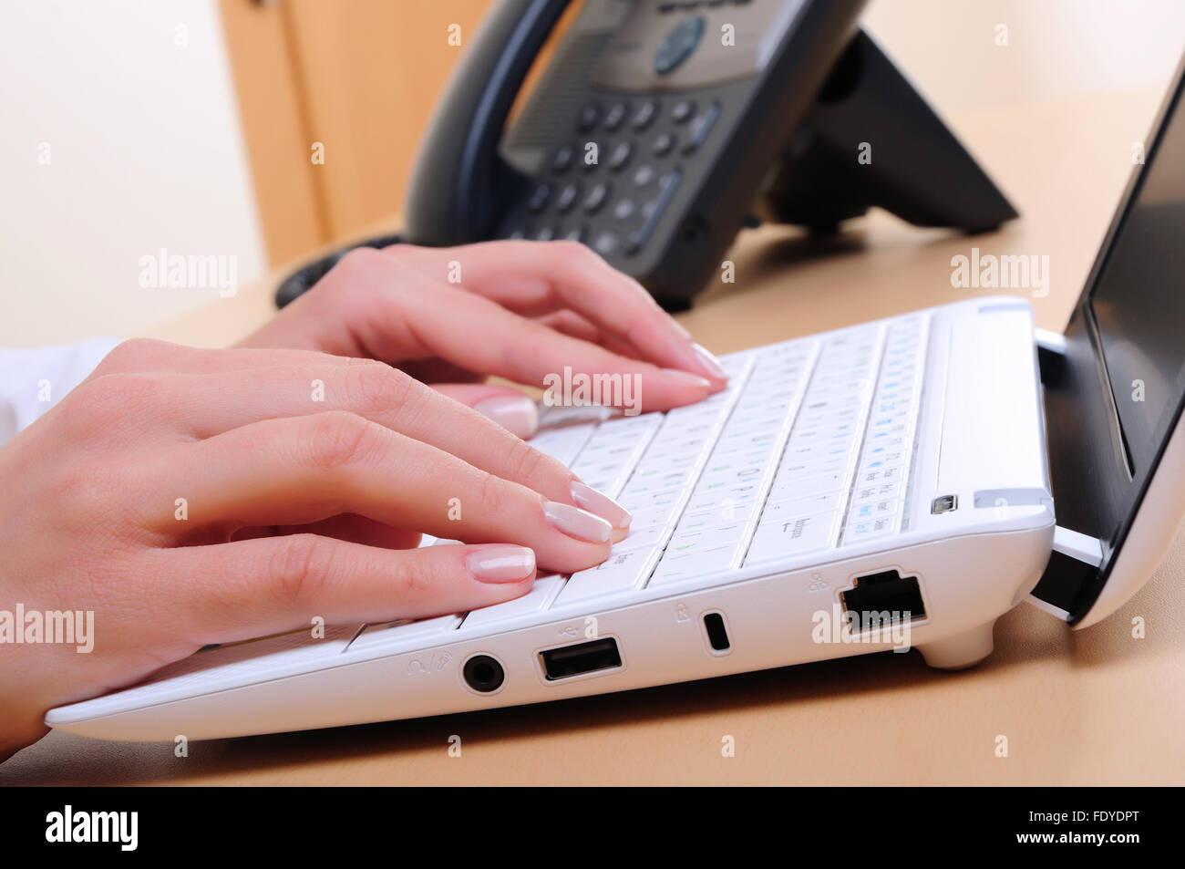 Hands of a young girl running on a computer in the office Stock Photo ...