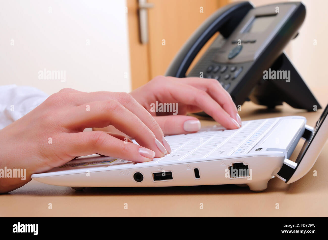 Hands of a young girl running on a computer in the office Stock Photo ...