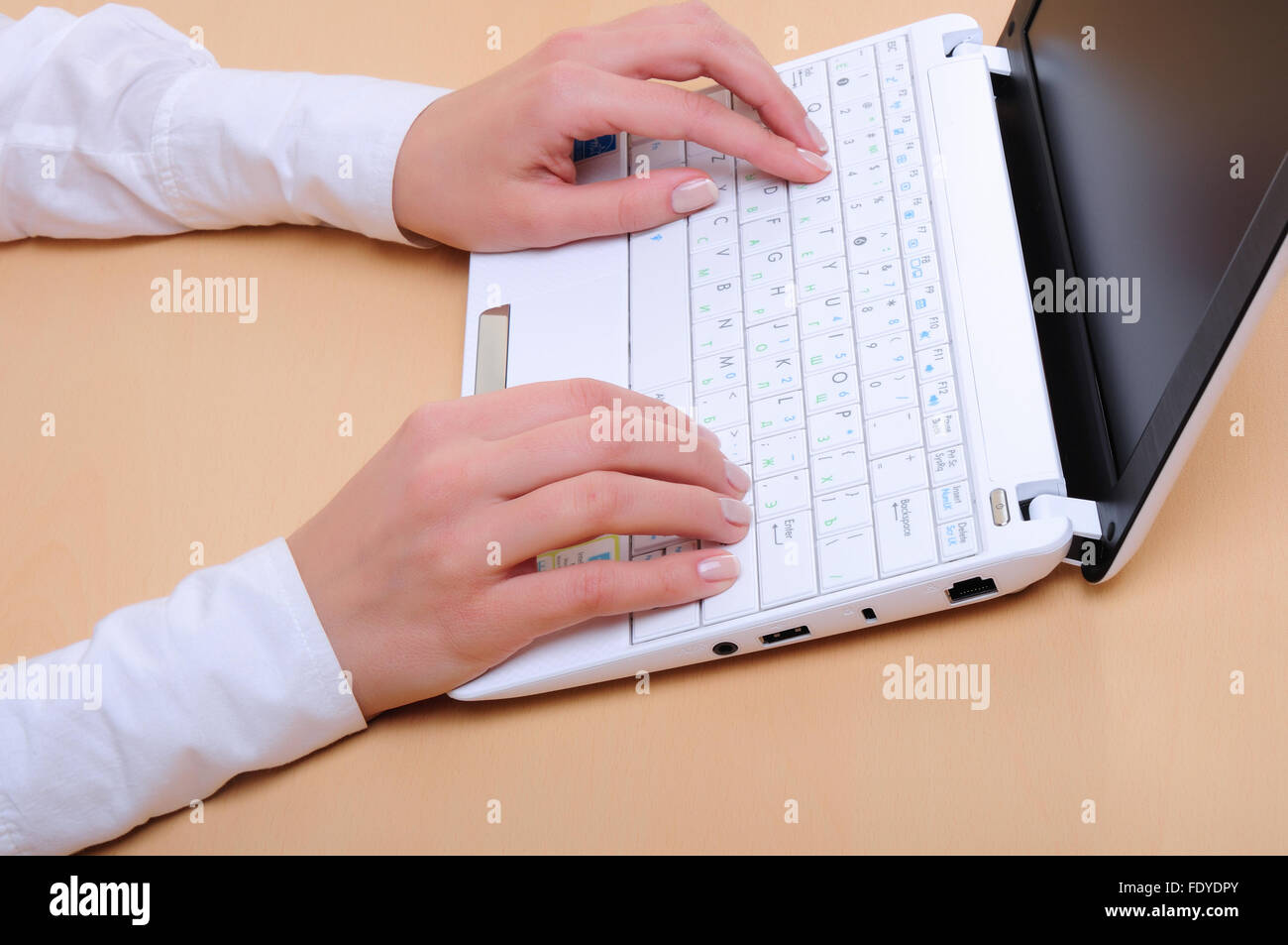 Hands of a young girl running on a computer in the office Stock Photo ...