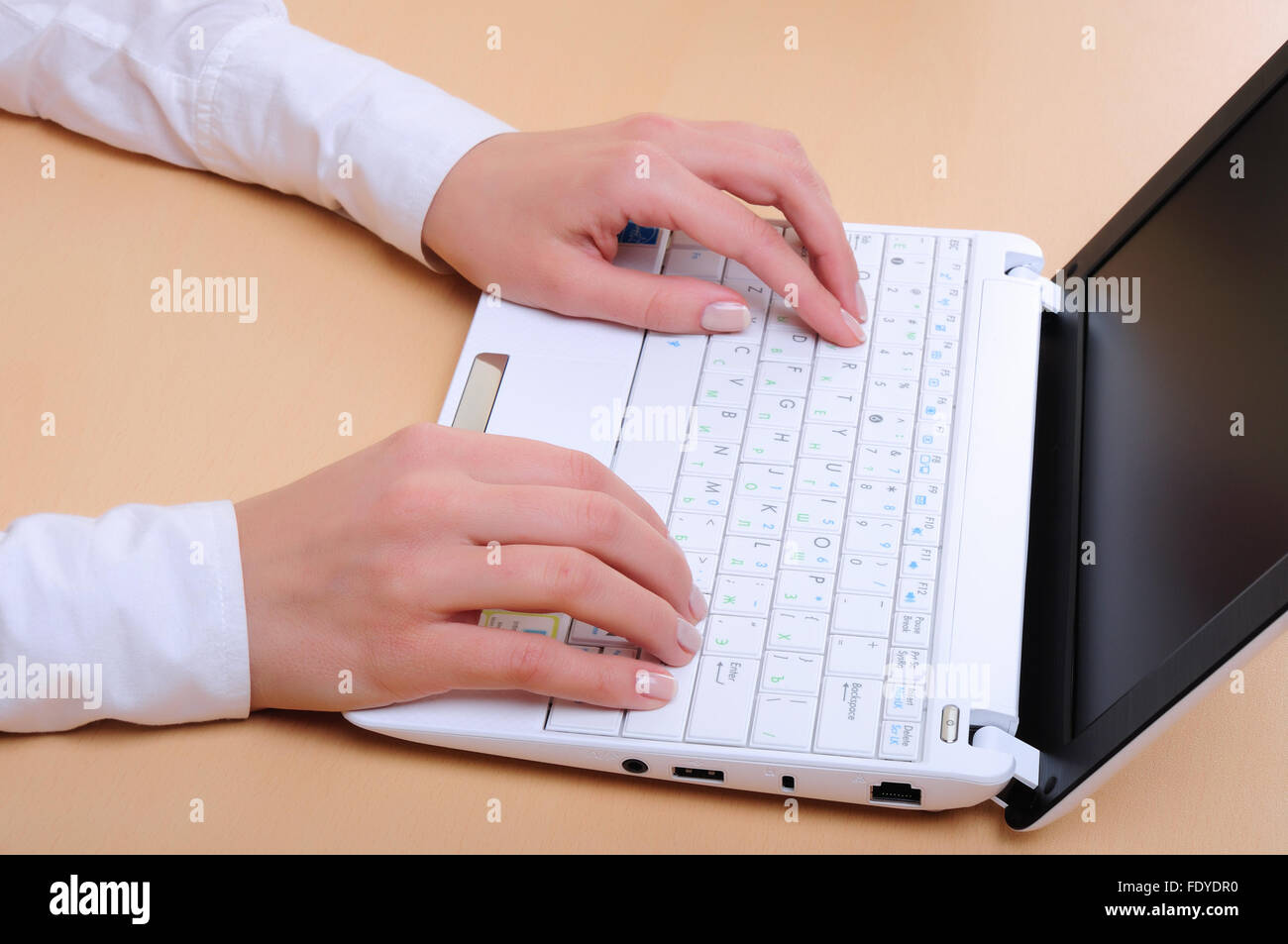 Hands of a young girl running on a computer in the office Stock Photo ...
