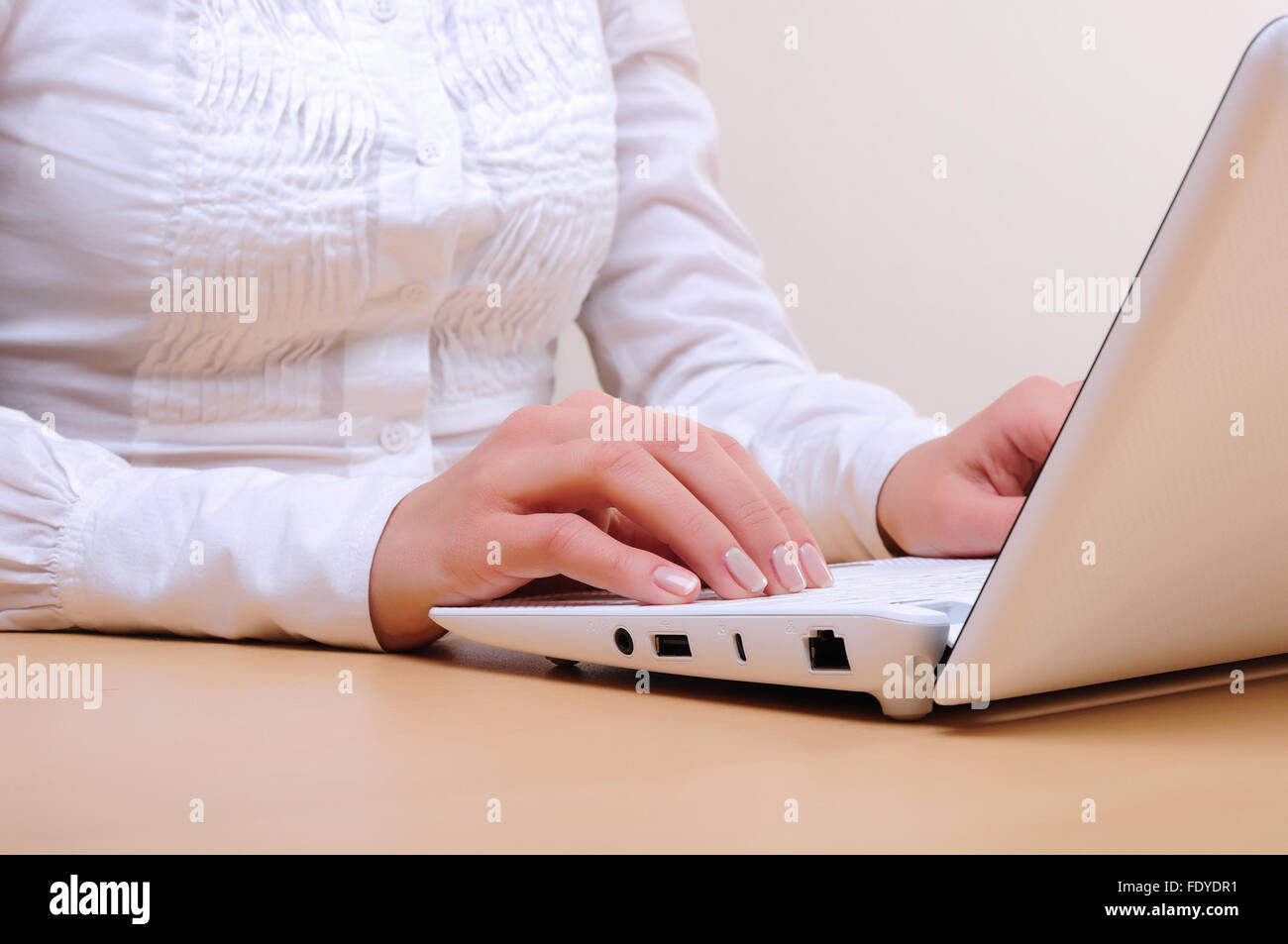 Hands of a young girl running on a computer in the office Stock Photo ...