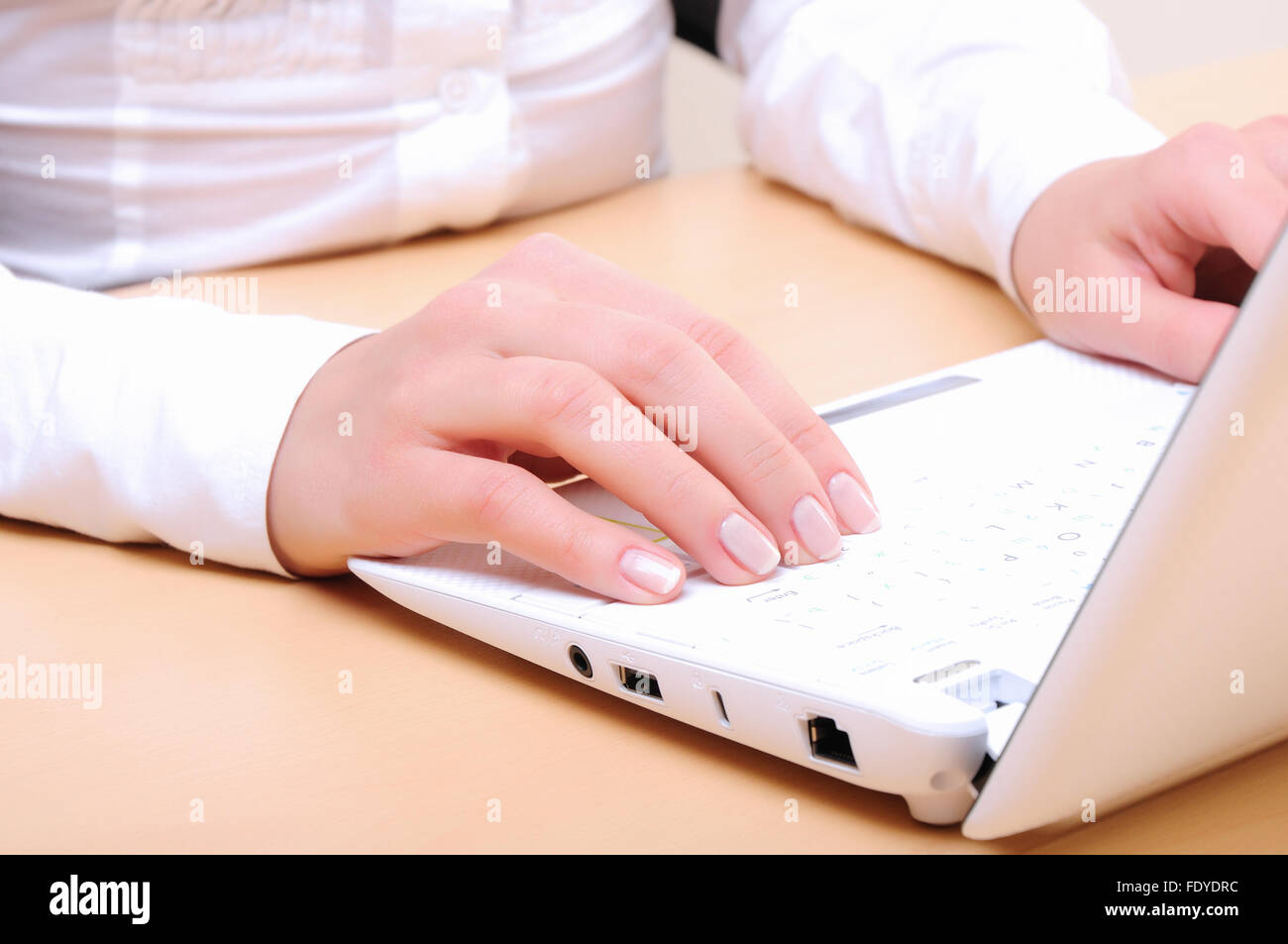 Hands of a young girl running on a computer in the office Stock Photo ...