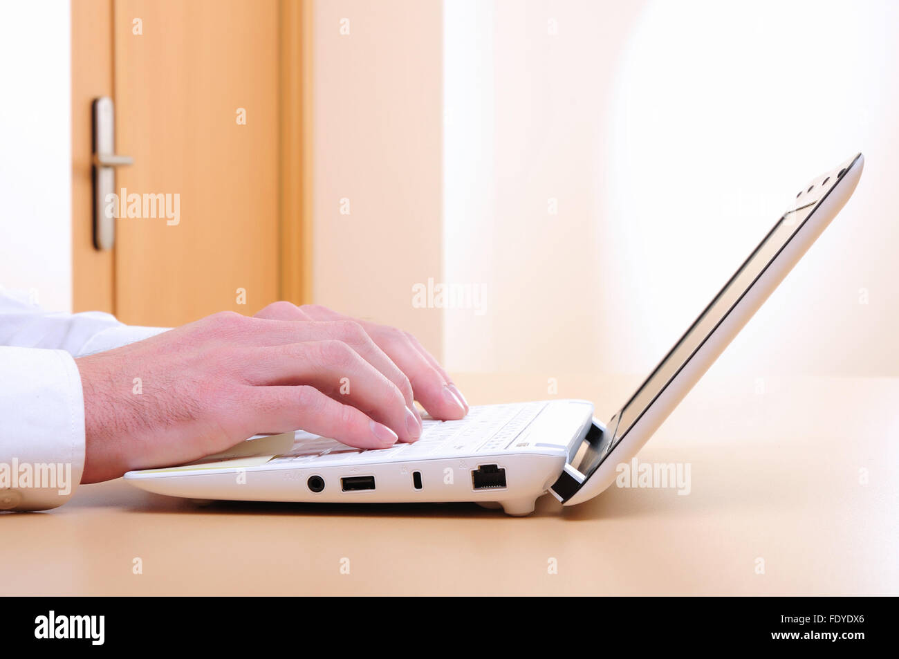 Hands of a young girl running on a computer in the office Stock Photo ...