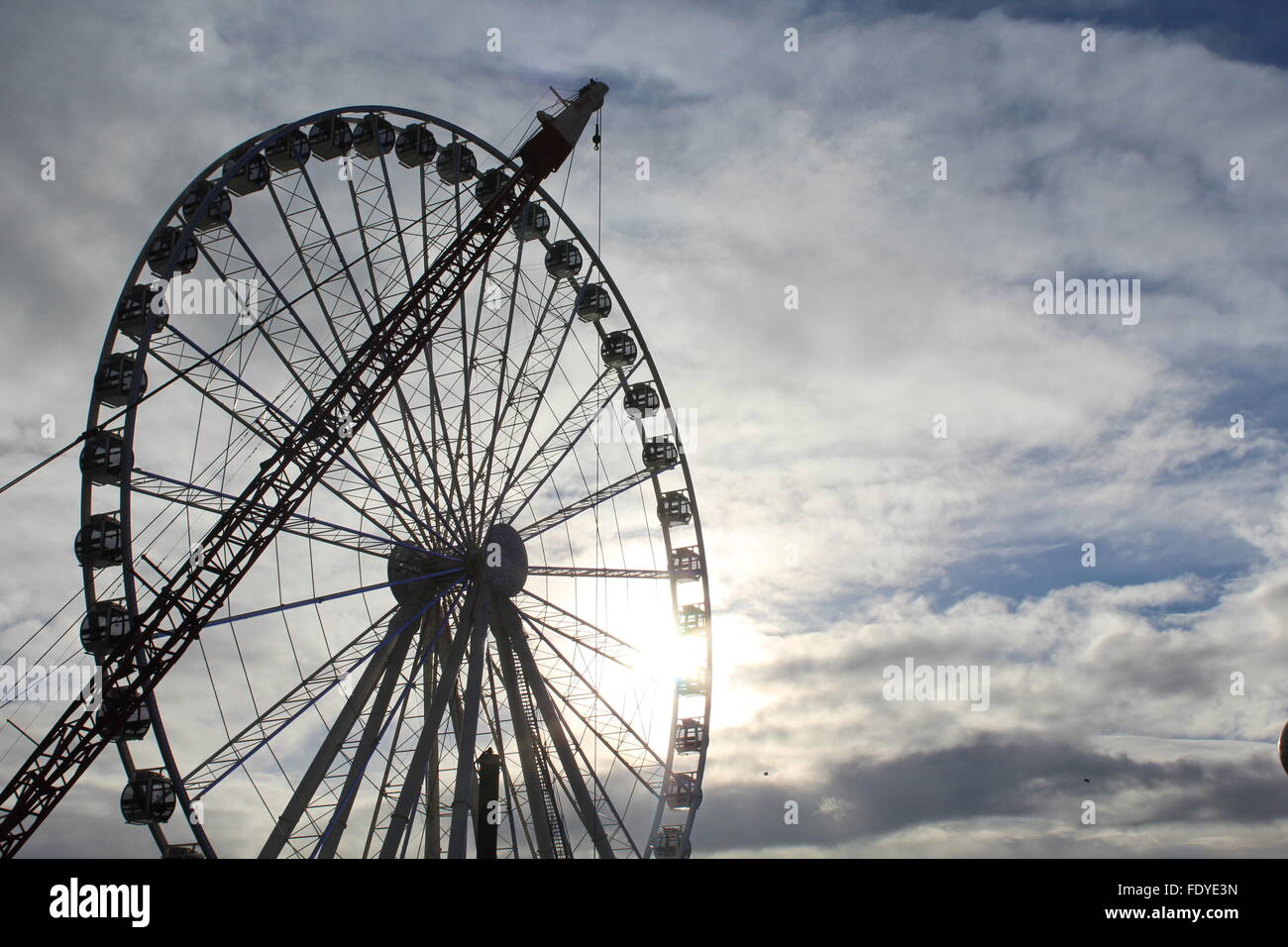 A ferris wheel in the midst of construction Stock Photo - Alamy