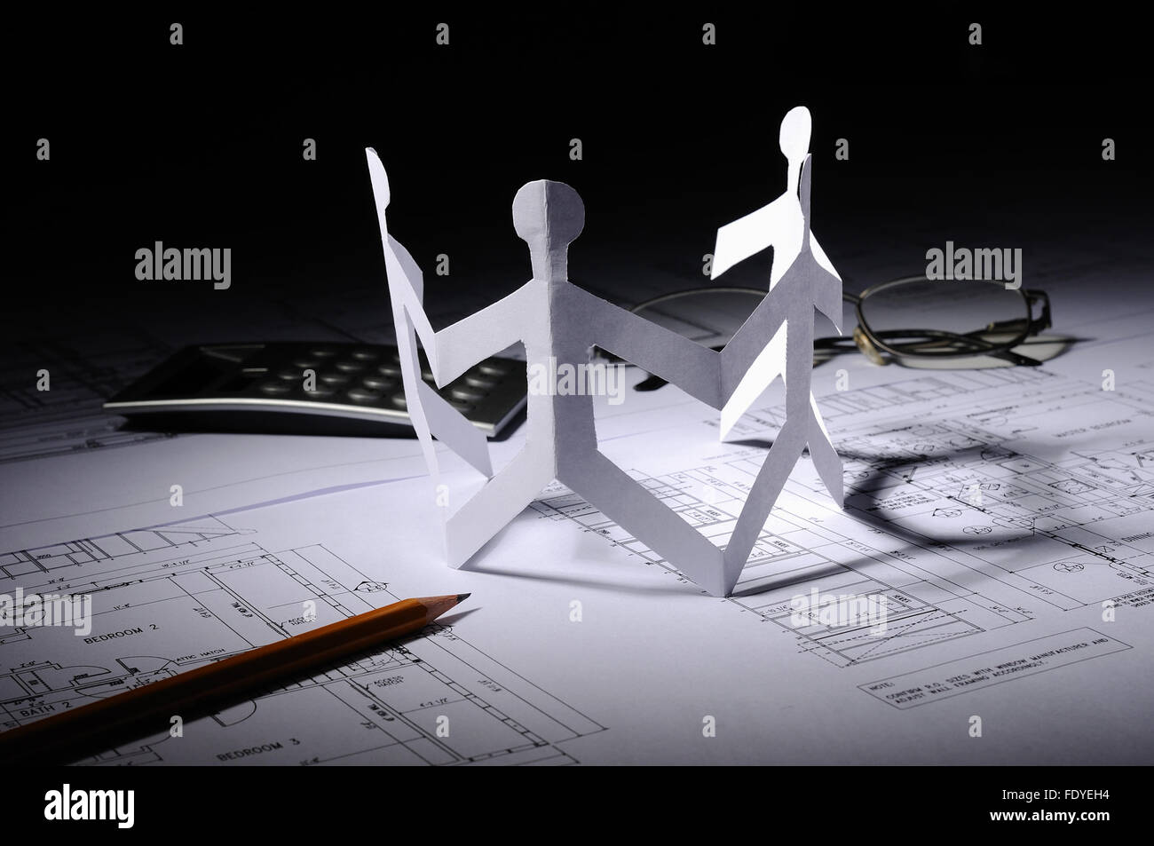 drawings of building and small paper manikins Stock Photo - Alamy