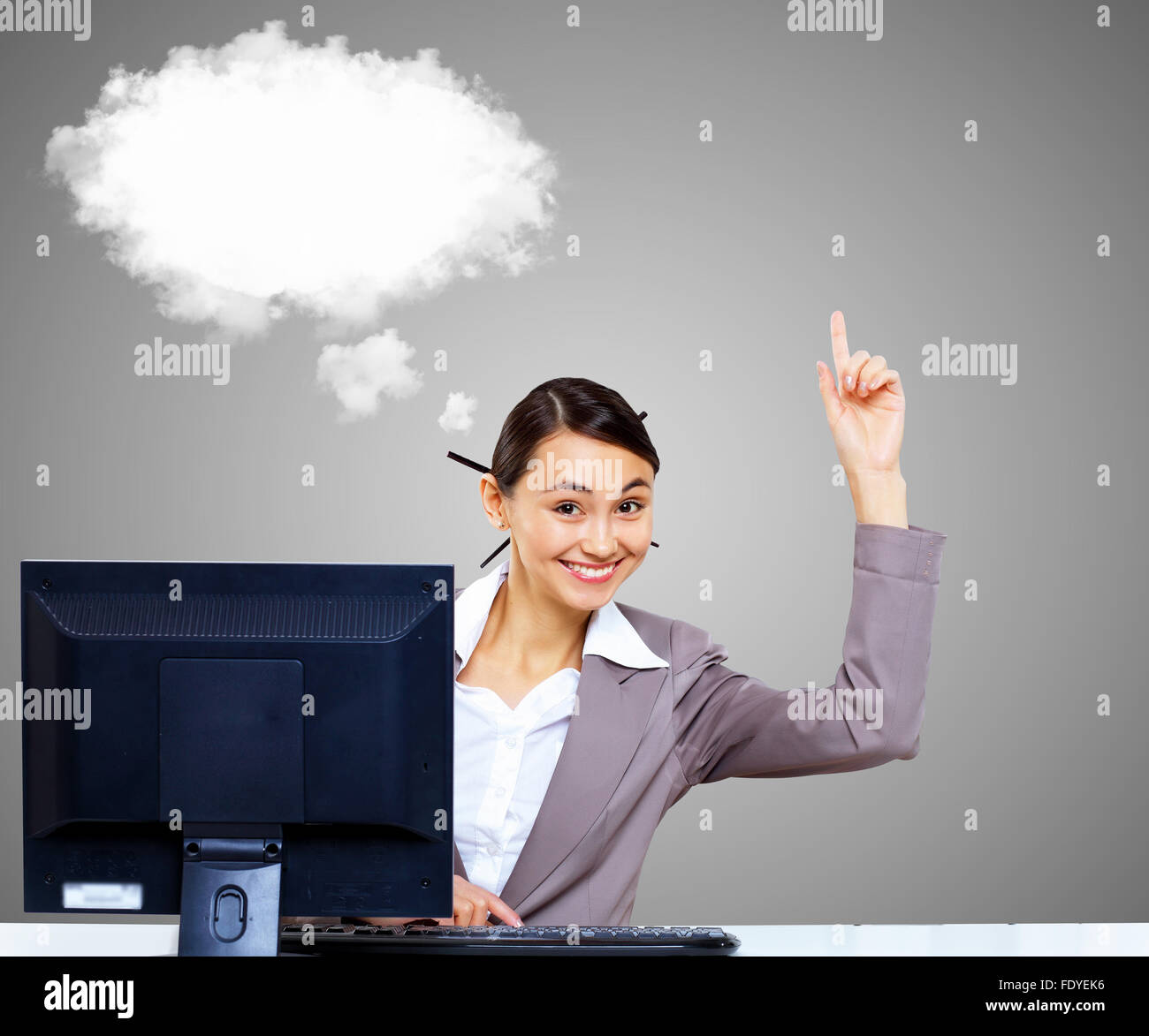 Young woman in business wear generating ideas in office Stock Photo - Alamy