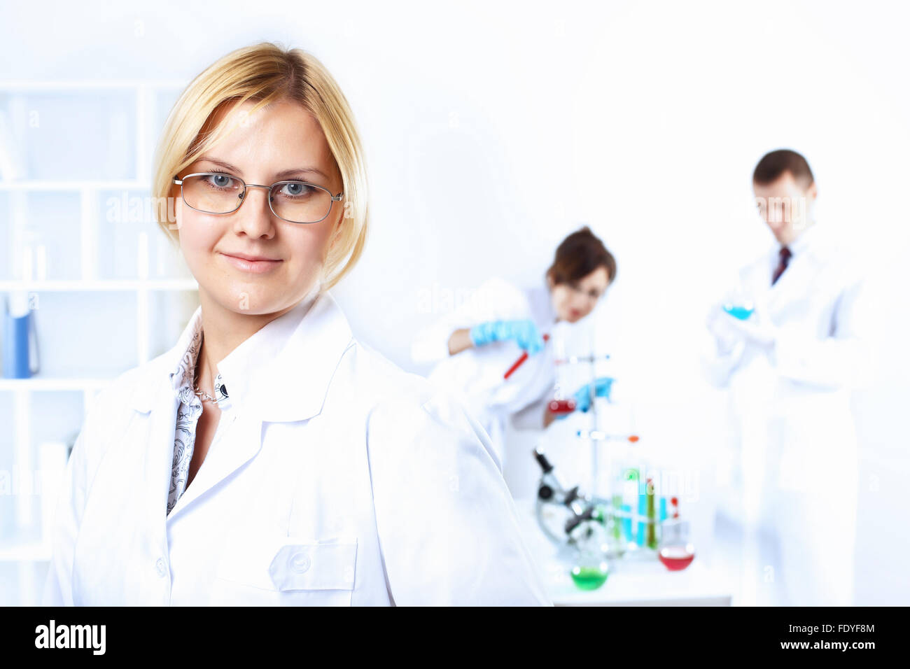 Scientist in uniform doing tests in laboratory Stock Photo - Alamy