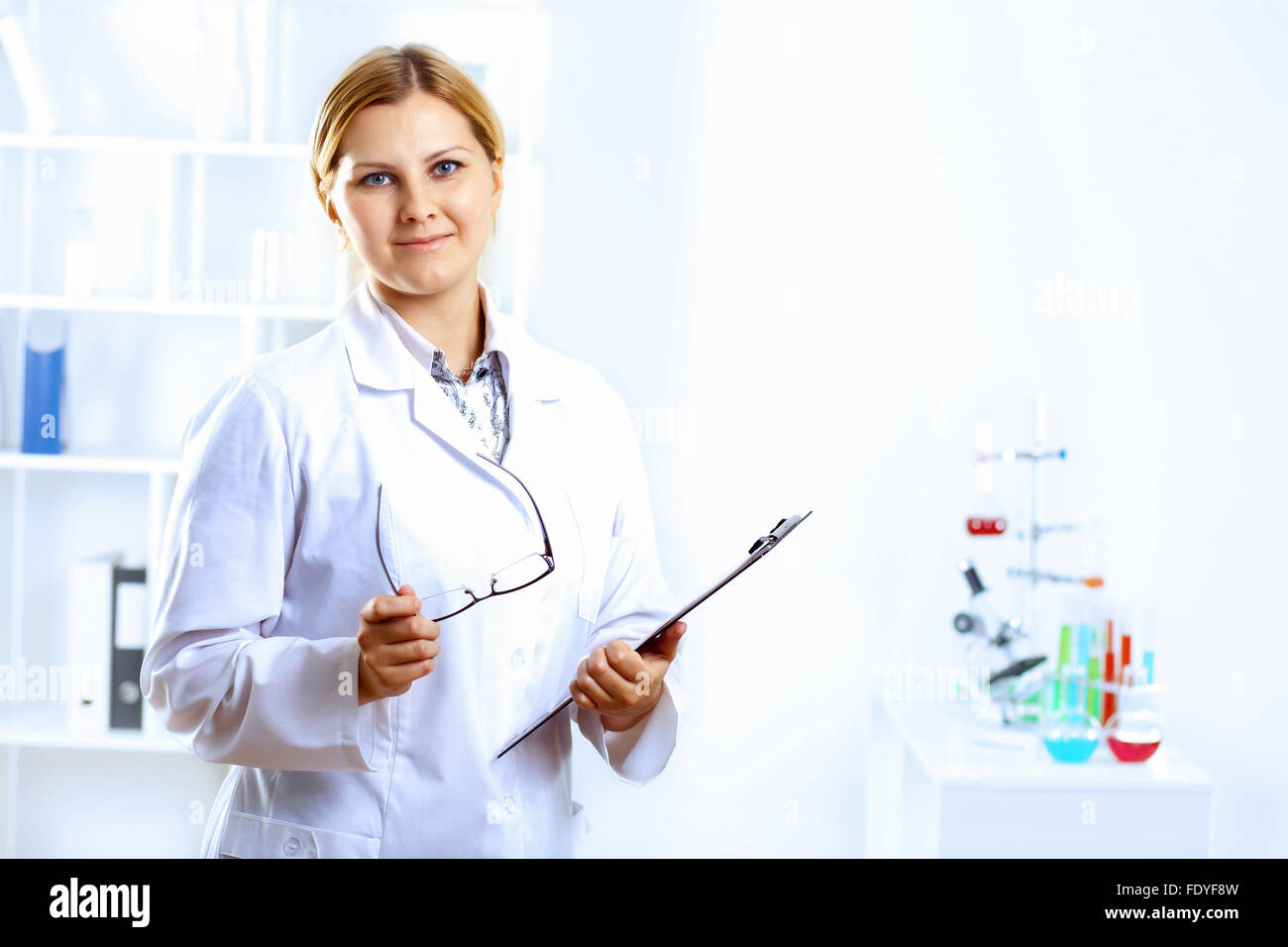 Scientist in uniform doing tests in laboratory Stock Photo - Alamy