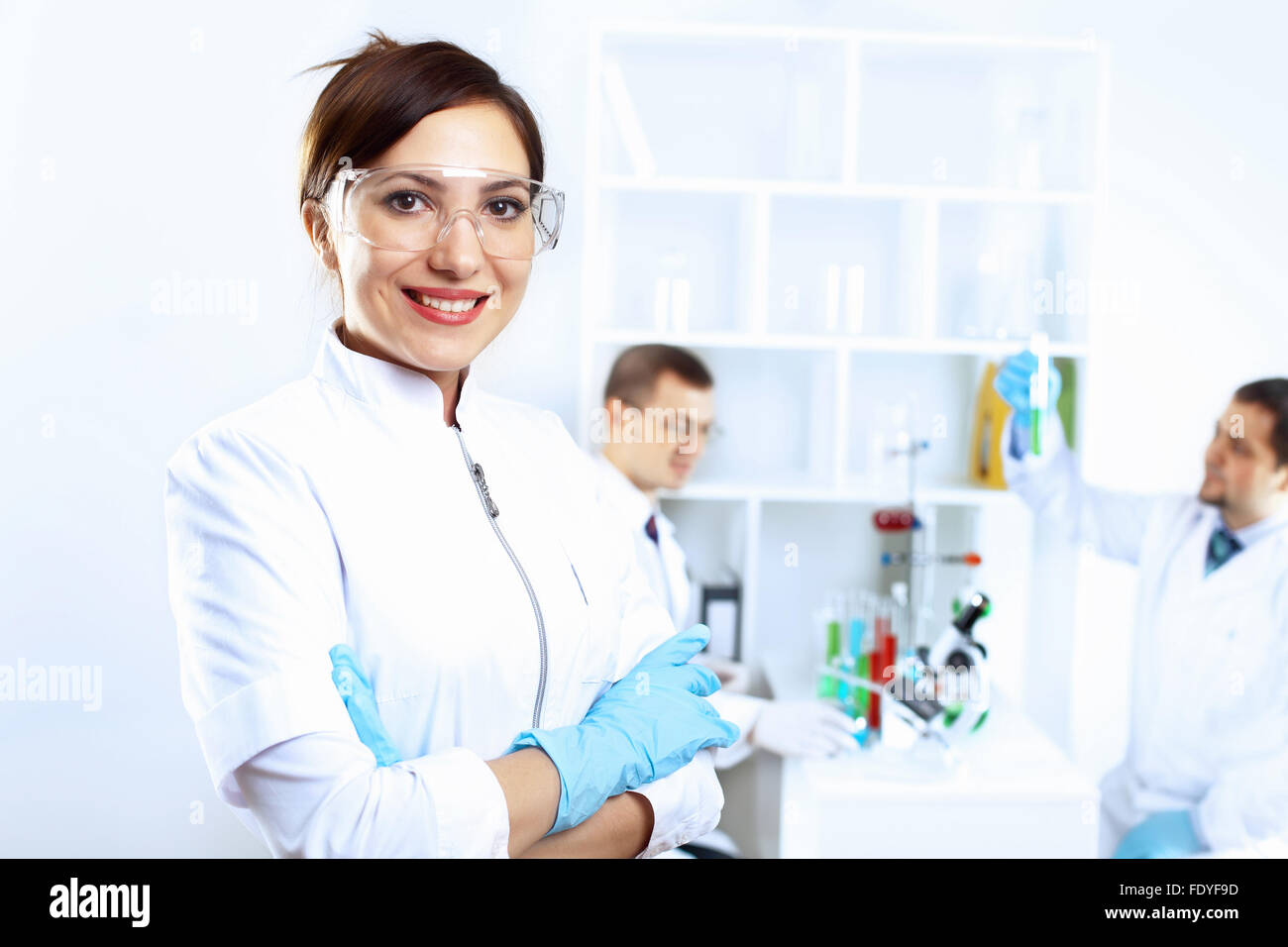 Scientist in uniform doing tests in laboratory Stock Photo - Alamy