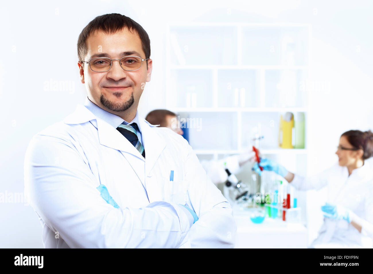 Scientist in uniform doing tests in laboratory Stock Photo - Alamy