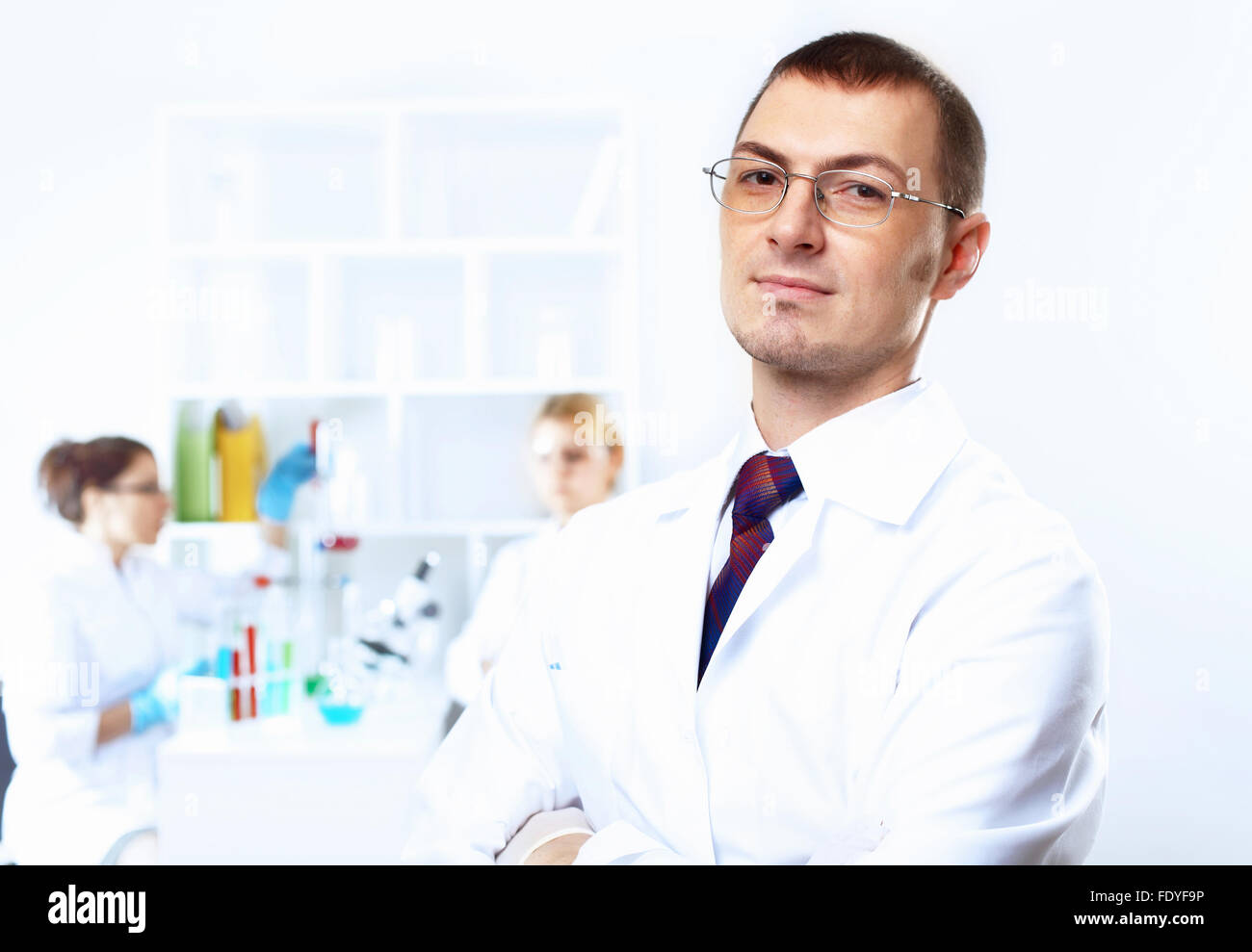 Scientist in uniform doing tests in laboratory Stock Photo - Alamy