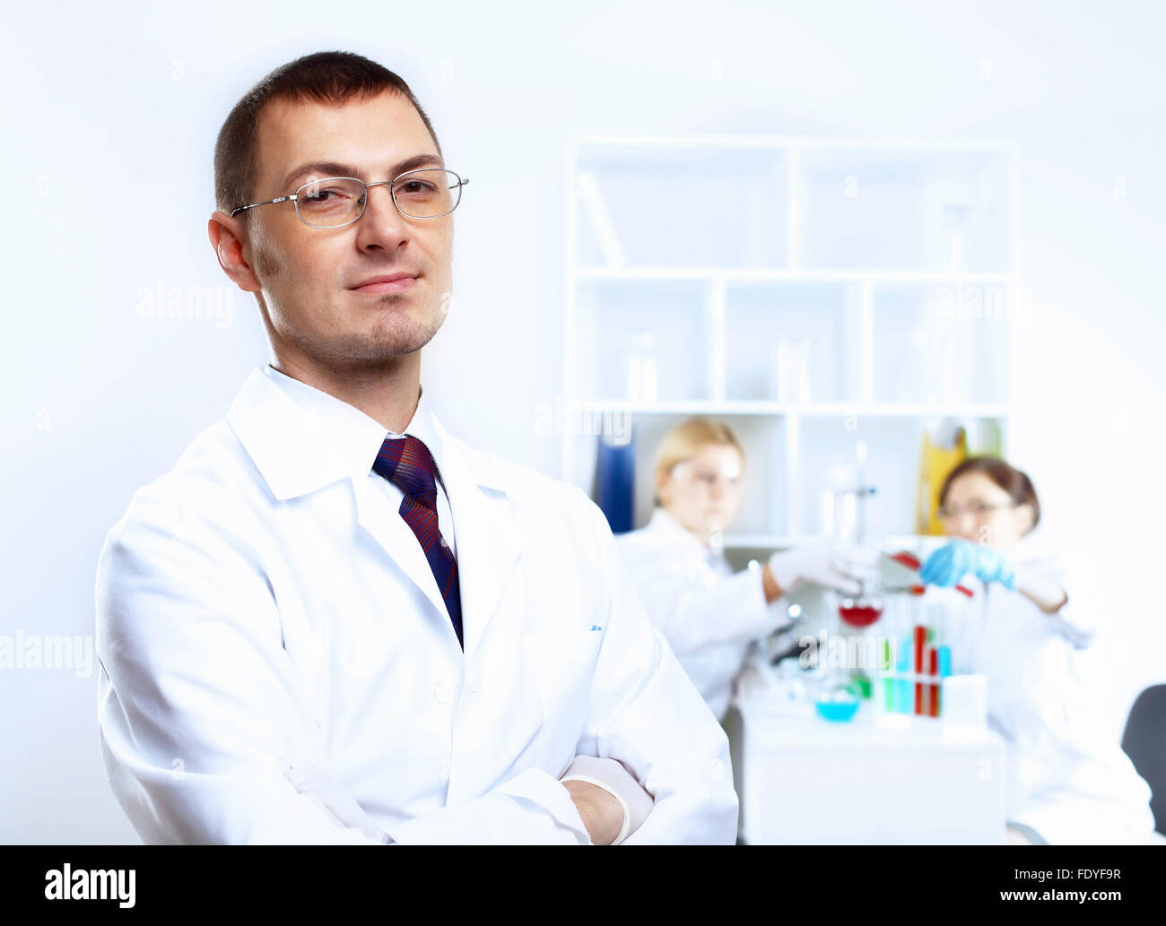Scientist in uniform doing tests in laboratory Stock Photo - Alamy